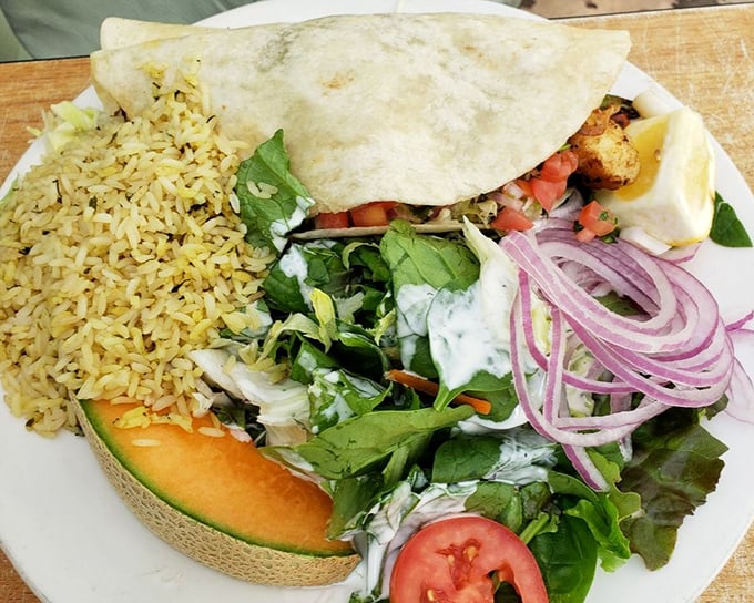Not just a taco, but a coastal celebration on a plate. The rice, the greens, the perfectly grilled fish—it's California's bounty wrapped in a warm embrace.