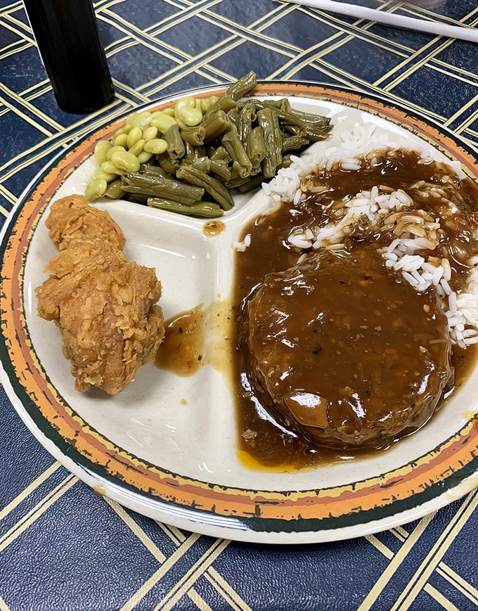 Southern comfort on a plate: hash and rice alongside green beans and lima beans. Proof that heaven exists and it's covered in gravy.