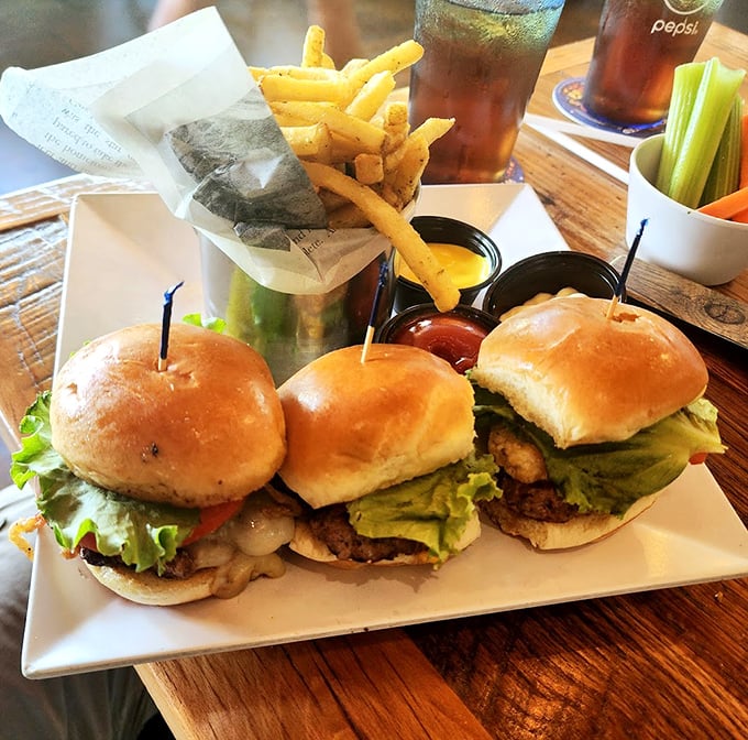 These slider trio beauties aren't just burgers—they're edible architecture, stacked with fresh ingredients and paired with golden fries that demand dipping.