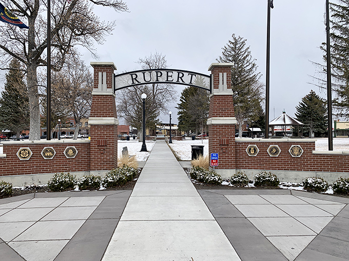 Winter's gentle touch transforms Rupert Square into a postcard-perfect scene, where the welcoming arch invites visitors into the heart of this charming community.