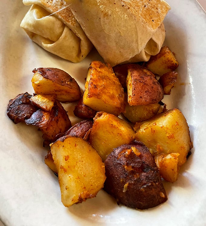 Golden-brown cubes of potato perfection – these aren't just home fries, they're little crispy monuments to what breakfast should always be.
