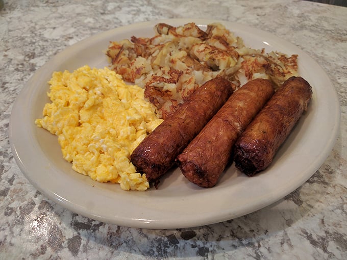 Breakfast perfection doesn't need to wear a tuxedo. Golden scrambled eggs, crispy hash browns, and sausage links that snap with each bite.