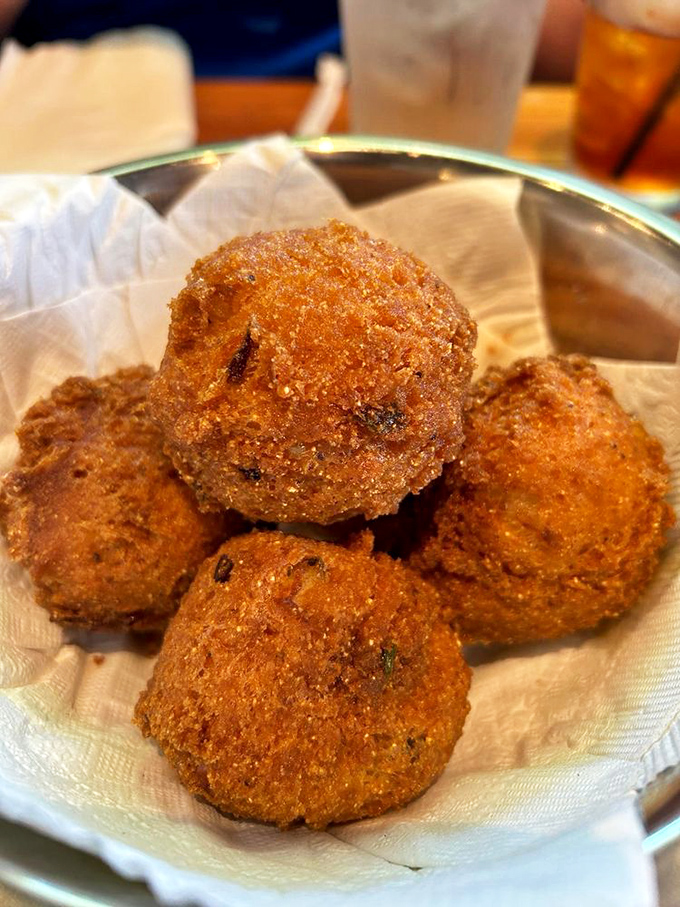 Golden-brown spheres of cornmeal perfection – these hush puppies aren't just side dishes, they're the main event that'll make you question all other fried foods.