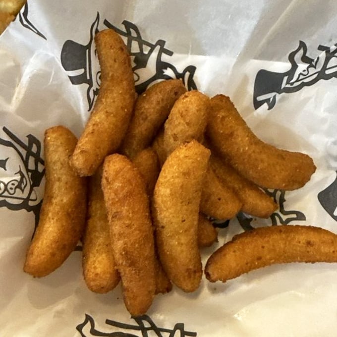Golden-brown cornmeal torpedoes that could make a vegetarian question their life choices. These hush puppies don't just speak – they sing.