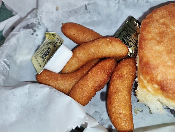 Hush puppies that crunch like your childhood memories should. These golden cornmeal treasures aren't just sides—they're the opening act to barbecue's main event.