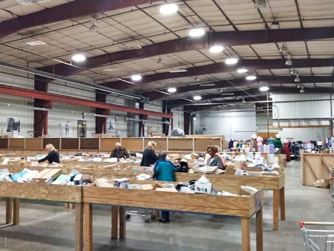 The warehouse atmosphere creates the perfect backdrop for discovery. No fancy lighting or pretentious displays—just pure, unadulterated deal-finding potential.