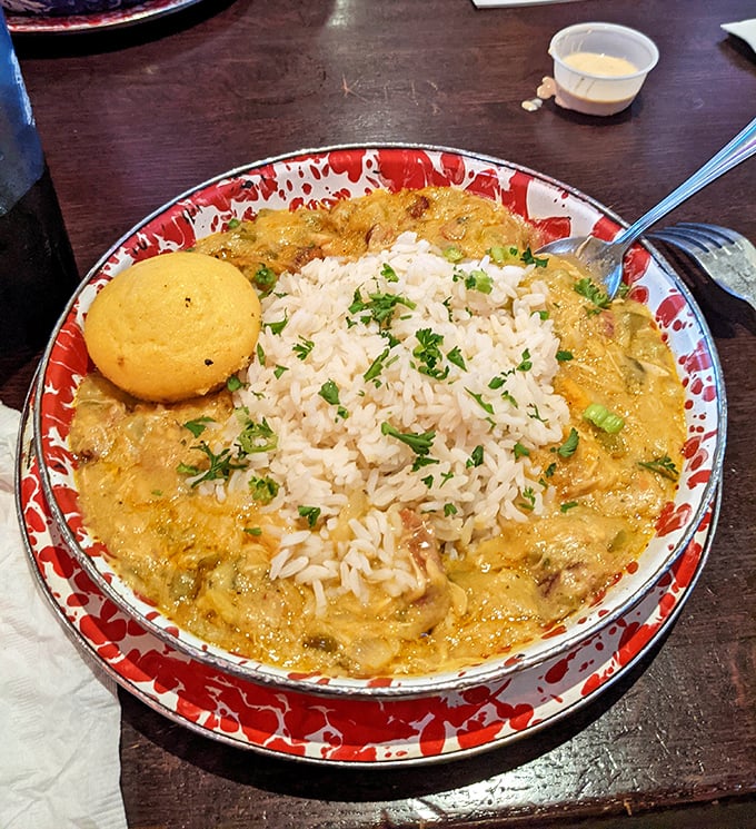 Jambalaya that would make New Orleans jealous – rice islands surrounded by a flavorful sea of Cajun goodness and that essential cornbread lifeboat.