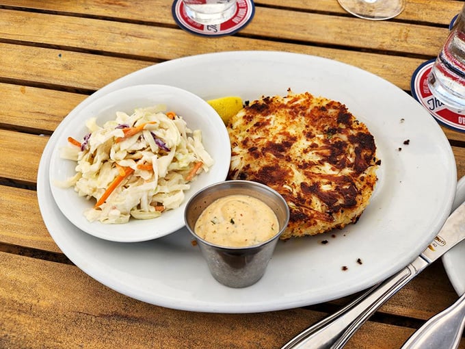 Golden-crusted perfection! This jumbo crab cake is what seafood dreams are made of – mostly crab, minimal filler, and that remoulade sauce deserves its own fan club.
