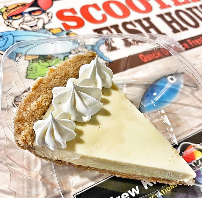 That key lime pie isn't just dessert, it's Florida sunshine on a plate – pale yellow filling, perfect graham crust, and whipped cream dollops of cloud-like perfection.