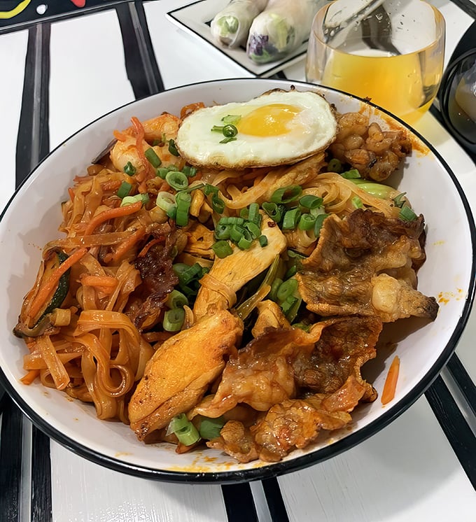 Korean Fire Noodles topped with a sunny-side-up egg—where spice meets art. Your taste buds will applaud while your sinuses clear!