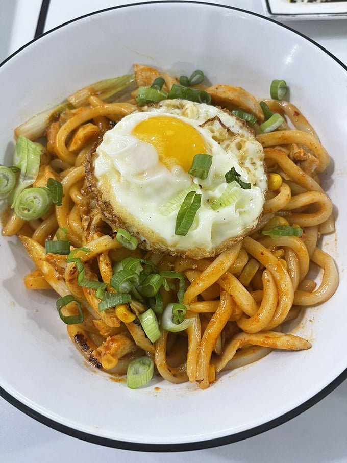 These Korean Fire Noodles aren't just food—they're an event. The sunny-side-up egg crowns these spicy noodles like a royal hat at the Kentucky Derby.