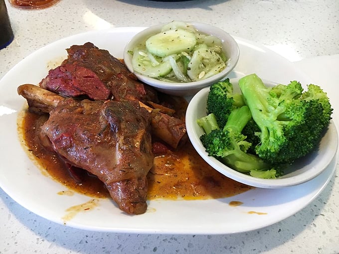 The legendary lamb shank doesn't just fall off the bone—it practically jumps onto your fork with enthusiasm.