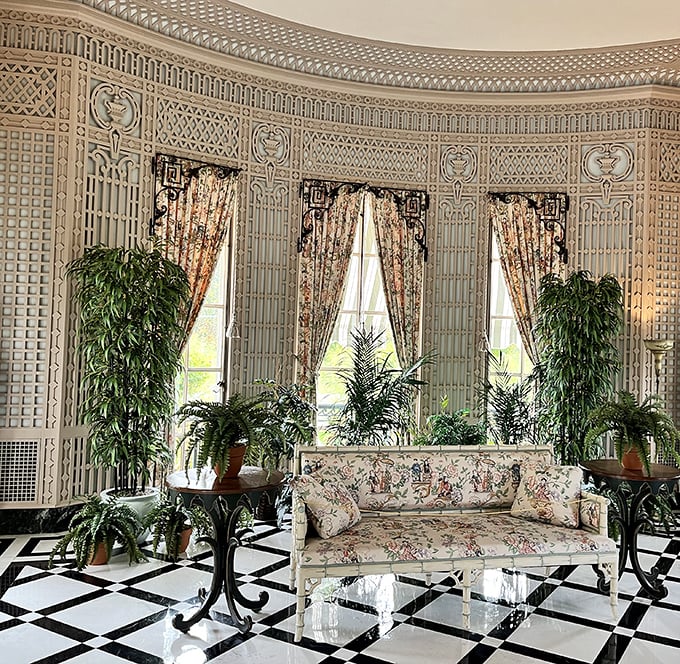 The conservatory where plants live better than most humans. Those lattice walls aren't just decorative—they're reminding your houseplants how inadequate they are.