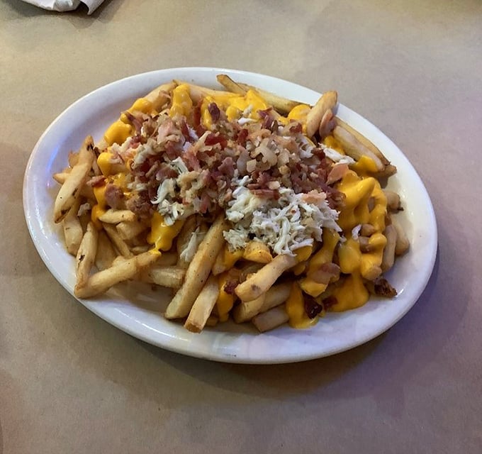 These loaded crab fries aren't just a side dish—they're the main event that locals whisper about at beach parties.