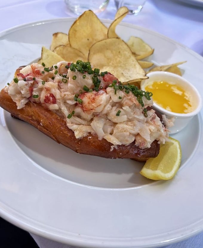 The lobster roll that launched a thousand return visits – sweet chunks of Maine lobster nestled in buttery brioche with house-made chips standing by for the encore.