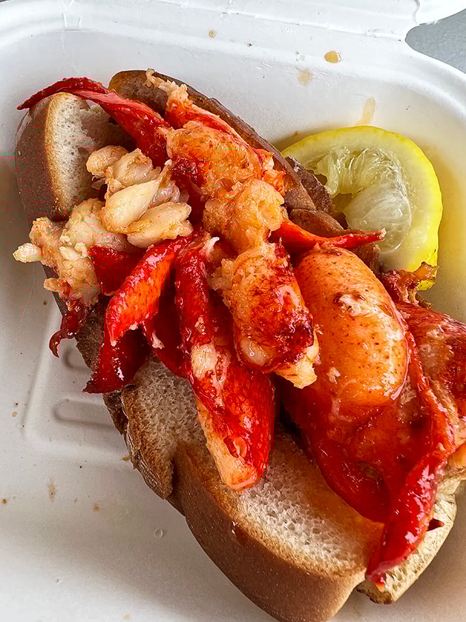 Connecticut's crown jewel: warm, buttery lobster meat spilling from a perfectly toasted roll. This isn't just food; it's edible poetry.