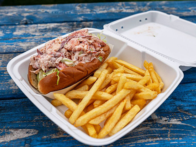 The star of the show: Kay's legendary lobster roll, bursting with sweet meat and nestled beside golden fries. This isn't just lunch – it's a Massachusetts maritime celebration.