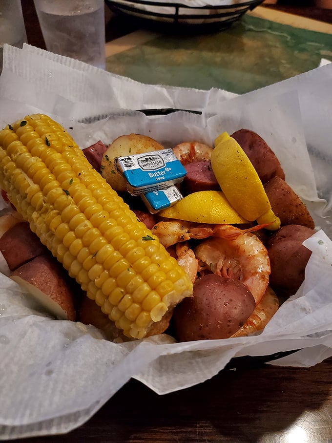 Low Country Boil perfection: where corn, potatoes, sausage, and shrimp become best friends in a seasoned hot tub. The butter packet is just showing off.