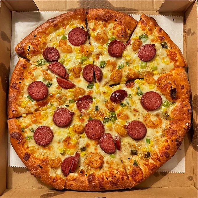 This isn't just pizza – it's edible artwork where pepperoni and green onions perform a delicious duet atop a golden-brown canvas of perfection.