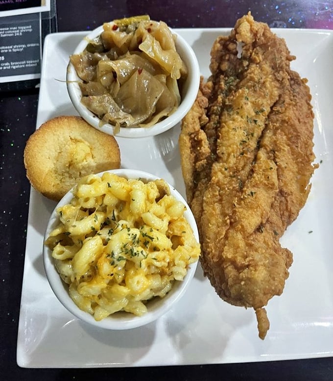 That golden, creamy mac and cheese paired with perfectly fried fish—this is what happiness looks like on a plate, friends.