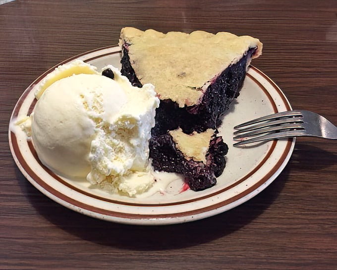The star of the show: marionberry pie with ice cream melting alongside. This isn't dessert—it's an edible postcard from Oregon's soul.
