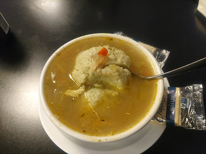 Matzo balls float like fluffy clouds in golden broth that could cure whatever ails you, real or imagined.