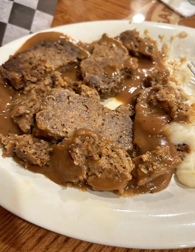 Behold the star attraction: meatloaf swimming in rich gravy alongside cloud-like mashed potatoes. Grandma would approve – and be slightly jealous.