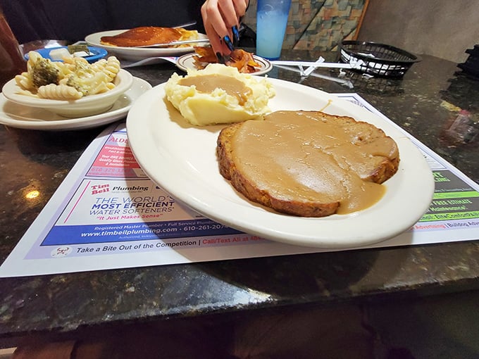 Meatloaf that makes you question every other meatloaf you've ever met. That gravy deserves its own fan club.