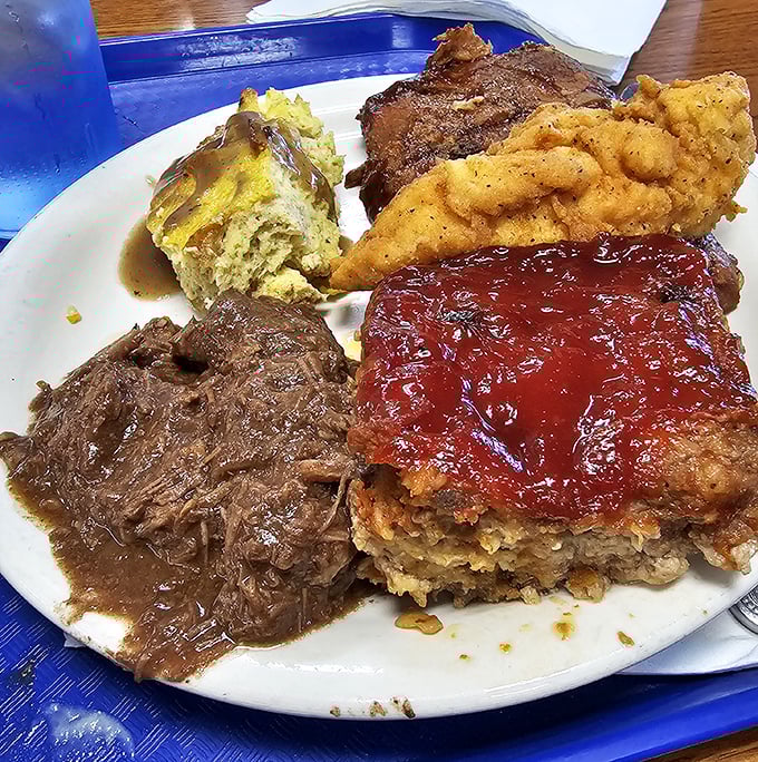 A plate that would make your grandmother proud—pot roast, meatloaf, fried chicken, and all the fixings competing for the title of "best bite."