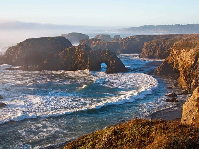 That's not a movie set—it's Mendocino's iconic sea arch, where the Pacific has spent millennia carving its masterpiece into the coastline.