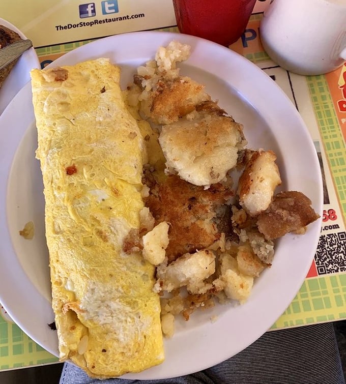 This omelet doesn't just whisper "good morning"—it belts out a Broadway-worthy breakfast anthem with perfectly crispy home fries as backup singers.