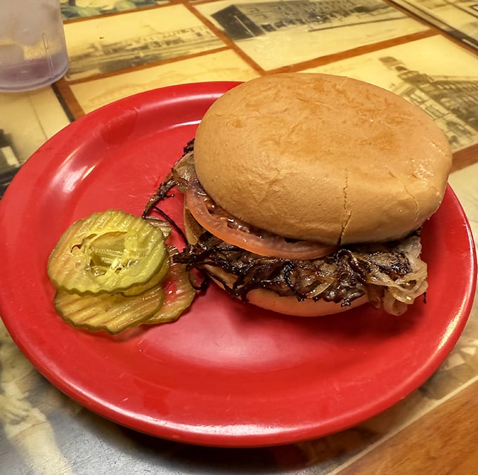 Behold the legendary onion burger in its natural habitat – a symphony of beef and caramelized onions that makes you wonder why all burgers aren't made this way.