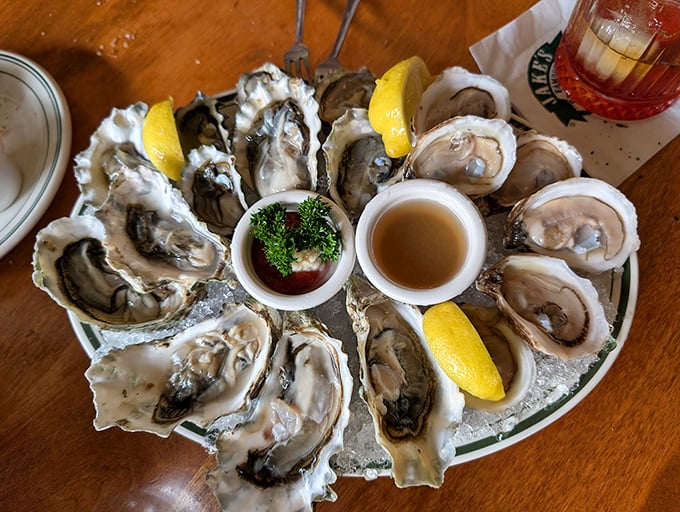 These oysters aren't just served; they're presented – plump treasures nestled on ice, waiting for a squeeze of lemon and that perfect moment of briny bliss.