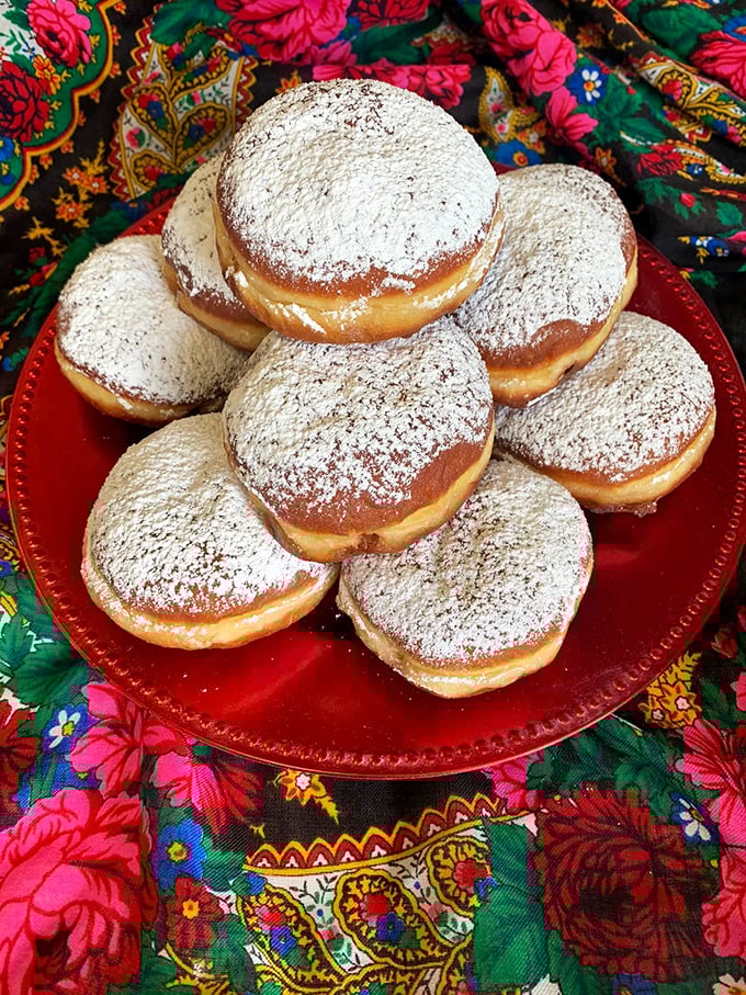 These powdered sugar-dusted pączki aren't just donuts – they're pillowy portals to Polish paradise. Resistance is futile, and calories don't count when culture's involved.