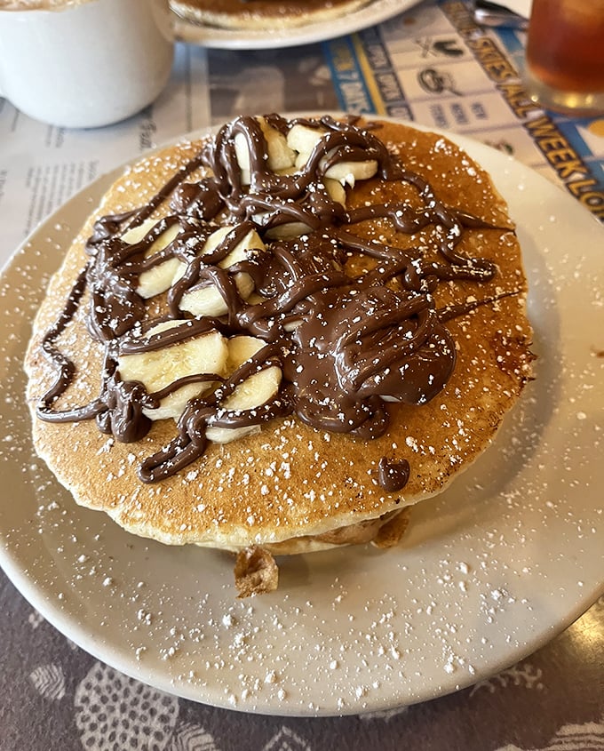 This pancake doesn't just have toppings—it's having a full-blown chocolate and banana party that your taste buds are definitely invited to.