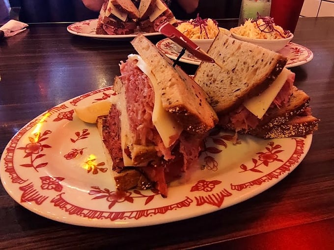 Behold the star of our show: a pastrami sandwich that doesn't just satisfy hunger—it resolves existential crises one perfect bite at a time.