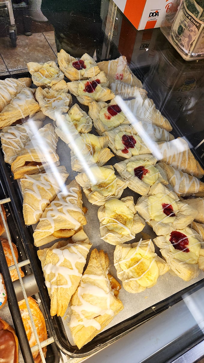Flaky pastries with fruit centers and drizzled icing wait patiently in the case, like edible jewelry too beautiful to eat—but you will anyway.