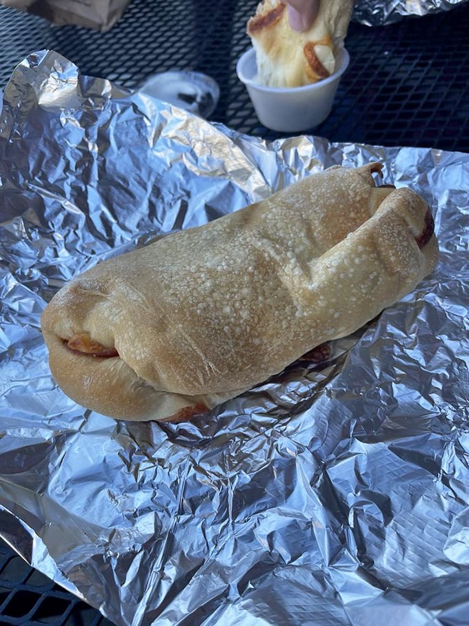 Not just any pepperoni roll—this is what happens when pretzel dough embraces pepperoni in a warm, cheesy hug that puts ordinary bread to shame.