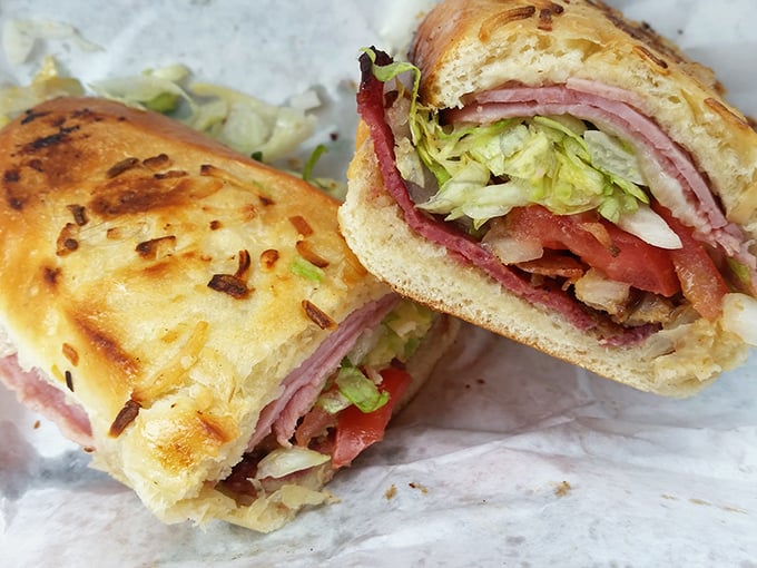 This isn't just a sandwich—it's architecture. Layers of ham, lettuce, and tomato create a cross-section worthy of a food museum. If sandwiches could talk...