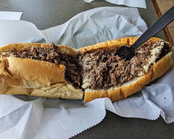 Behold, the perfect marriage of beef and cheese, where thinly sliced ribeye meets its melty soulmate in a roll that's both pillow and fortress.