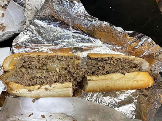 The holy grail of Philly cheesesteaks – thinly sliced ribeye nestled in a perfect roll. This isn't just a sandwich; it's a religious experience.