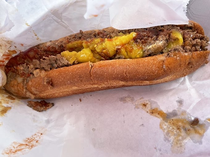 Behold the star of the show—thinly sliced steak embraced by melted Cheez Whiz on a perfect roll. This isn't a sandwich; it's a Pennsylvania birthright.