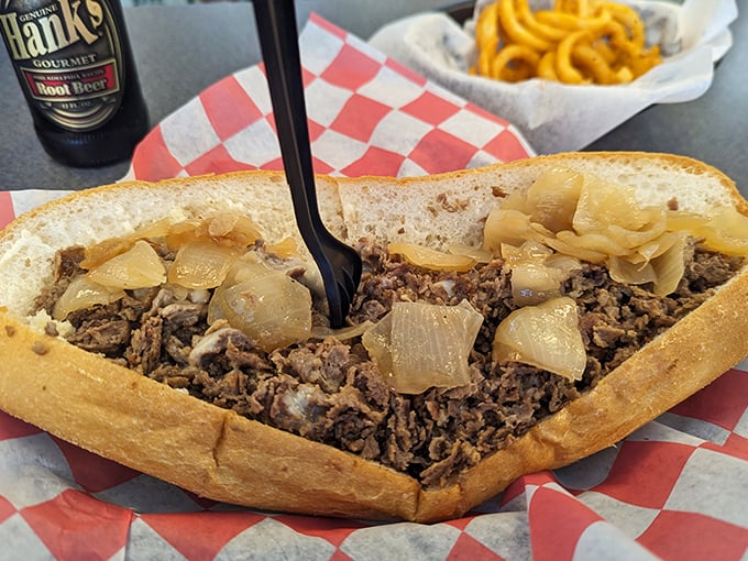 Behold the star of the show – a perfectly executed cheesesteak with caramelized onions that would make even the most stoic Philadelphian shed a tear of joy.