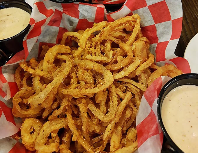 Golden, crispy onion rings that make such a satisfying crunch, you'll want to apologize to your dining companions for the noise – but they'll be too busy reaching for another to mind.