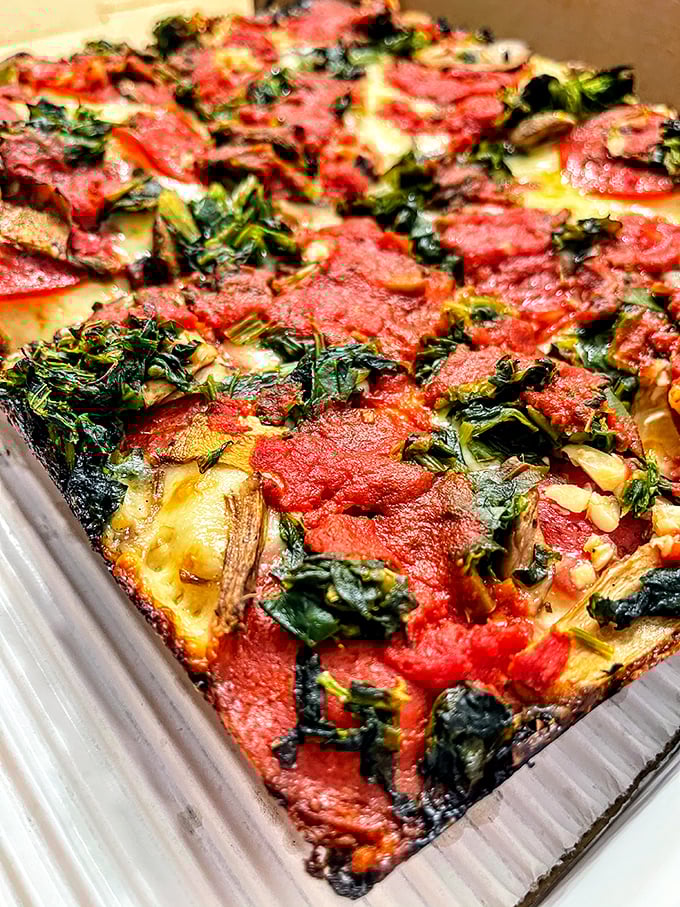 This isn't just pizza—it's architecture. Those crispy edges and that sauce-to-cheese ratio deserve their own blueprint.