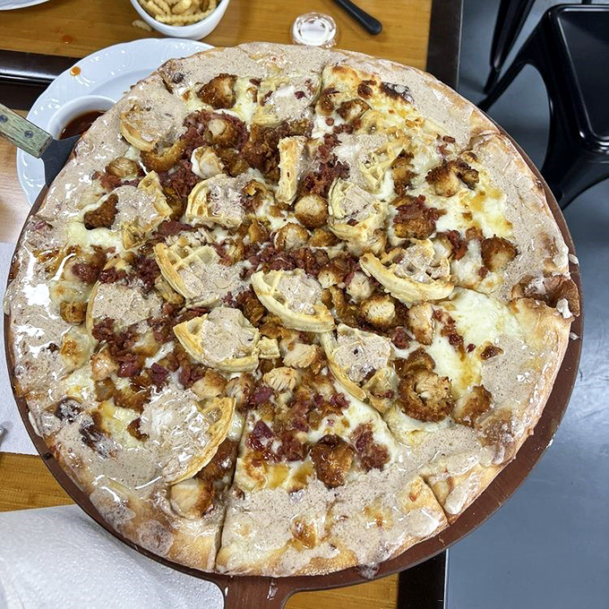 This white pizza with artichoke hearts and sausage isn't just food – it's edible artwork that makes you question why you'd ever settle for delivery.