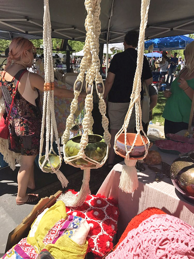 Macramé plant hangers swing gently in the summer breeze, bringing 1970s bohemian vibes back with a vengeance that would make your grandma proud.