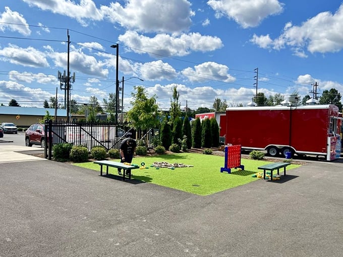 The plaza's green space offers a perfect spot to enjoy your food cart treasures, complete with games for when you need a between-bites activity.