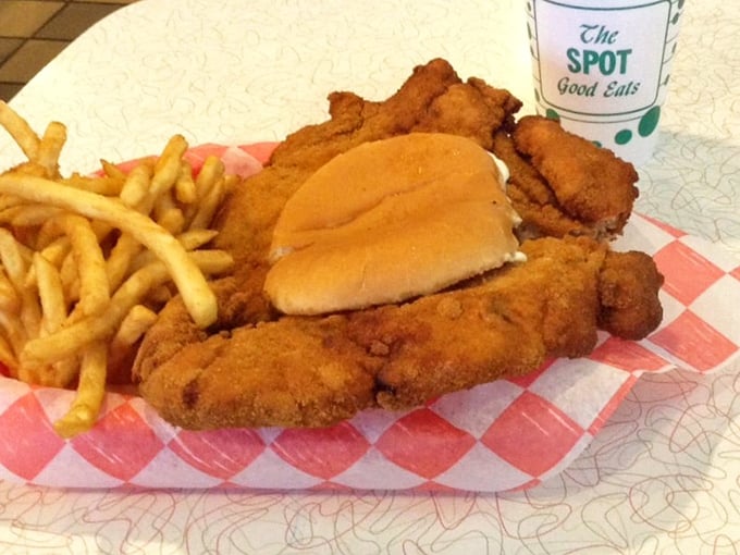 The legendary tenderloin sandwich – where the meat refuses to acknowledge the boundaries of its bun. Worth every napkin you'll need.