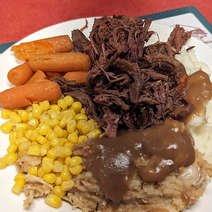 Behold the pot roast in its natural habitat—fork-tender beef surrounded by vegetables that have been promoted from side dish to essential co-stars.